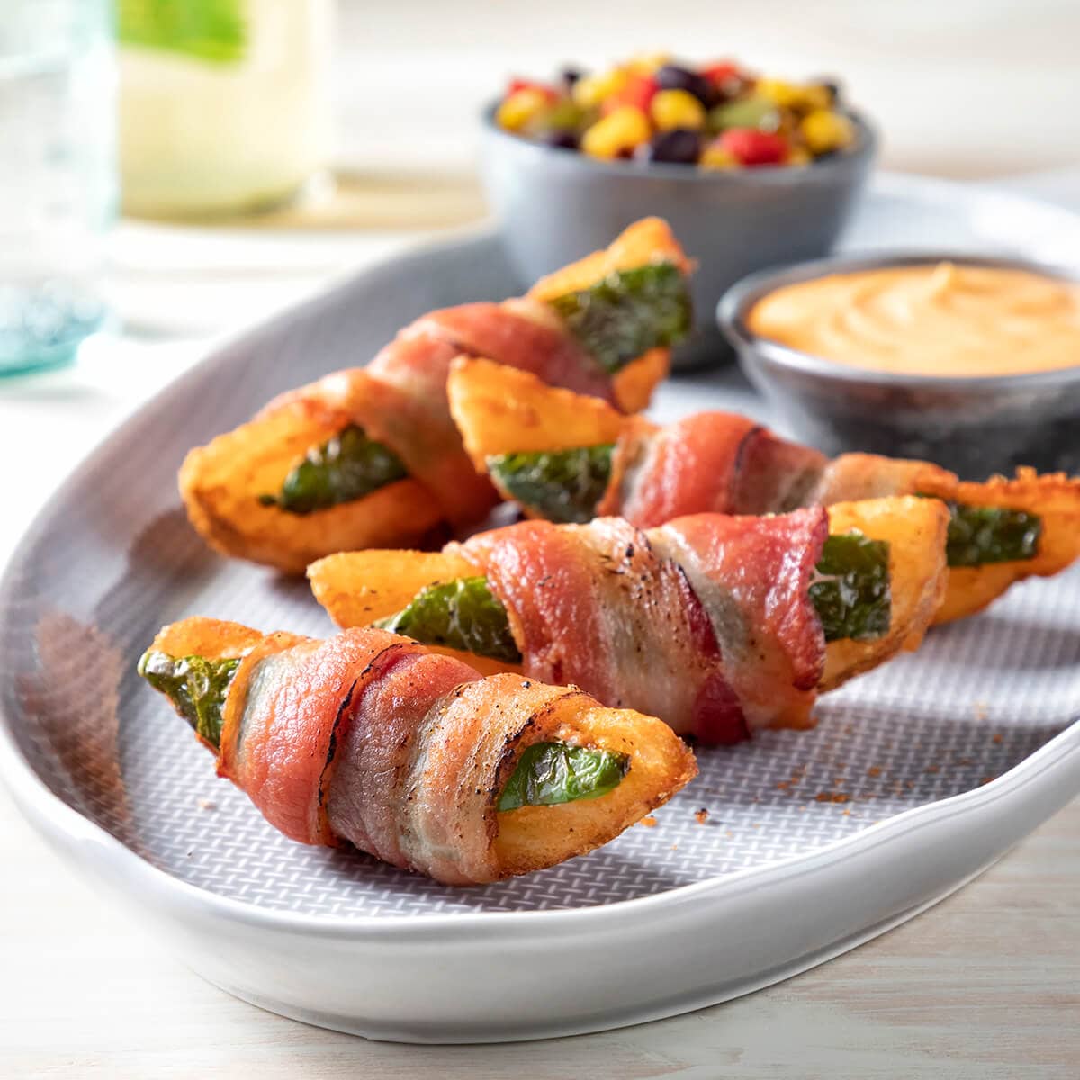 Bacon Wrapped Wedge Fries, Cowboy Caviar and Cheese Sauce | Simplot Foods