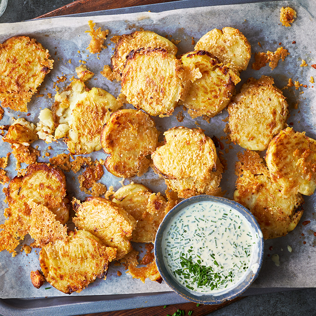 Tom Kerridge's Crispy Parmesan Potatoes with Blue Cheese Ranch Dressing Recipe | Ocado