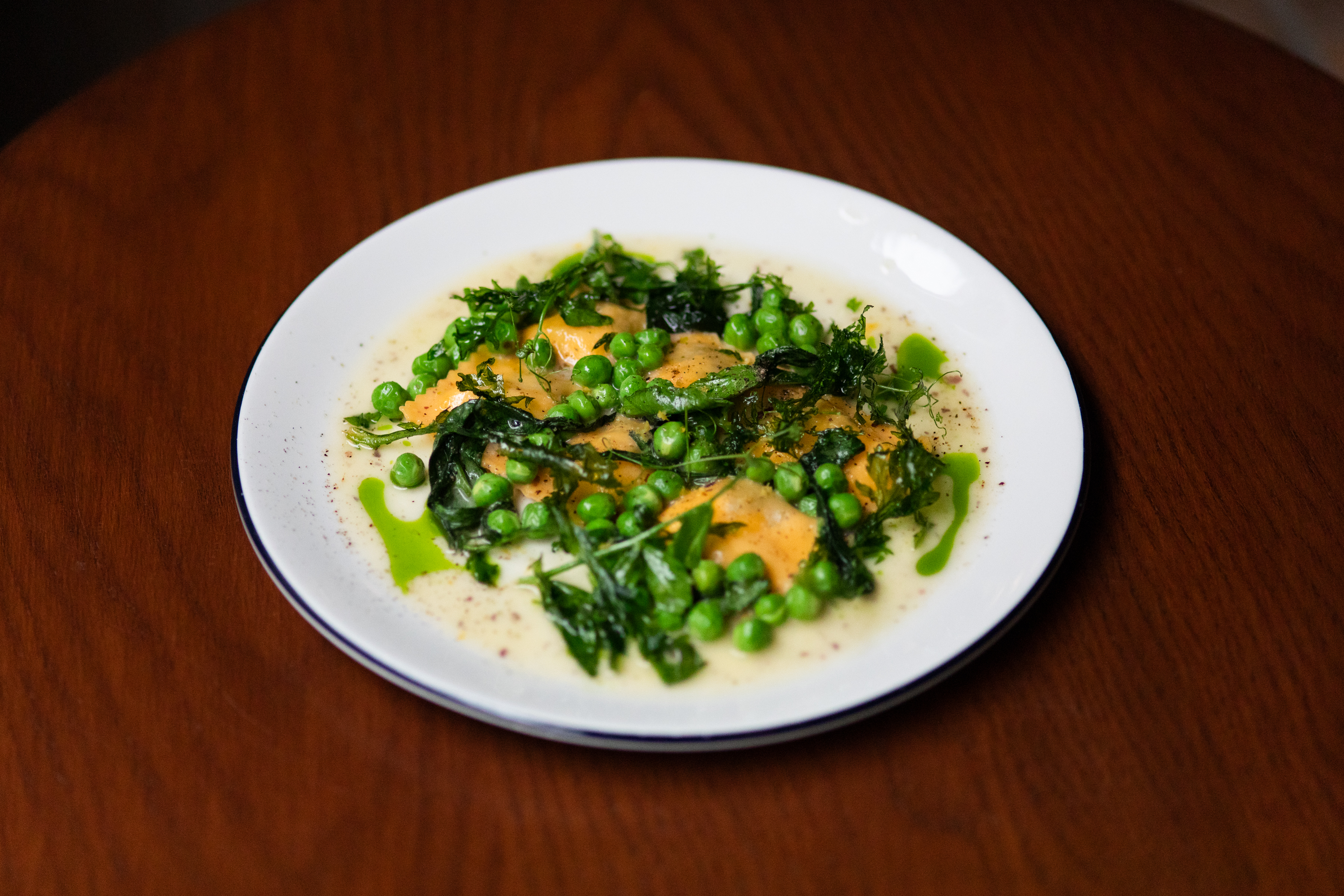 Fava beans and English peas color farmers market stands | KCRW