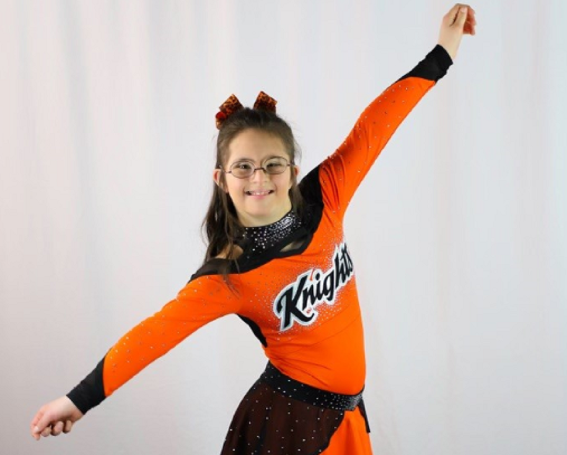 Cheerleaders draw inspiration from teammate with Down syndrome