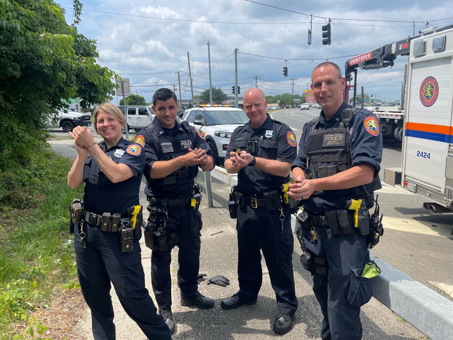 Nassau police officers rescue ducklings from sewer grate in Massapequa