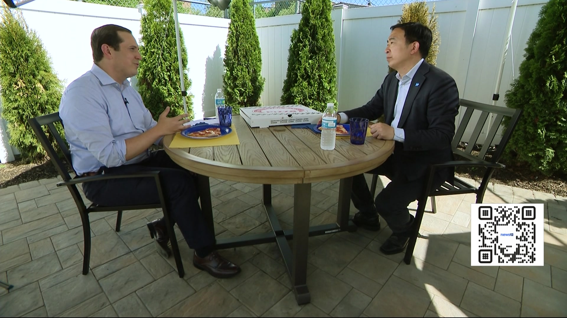 Pizza and Politics: Mayoral candidate Andrew Yang grabs a slice