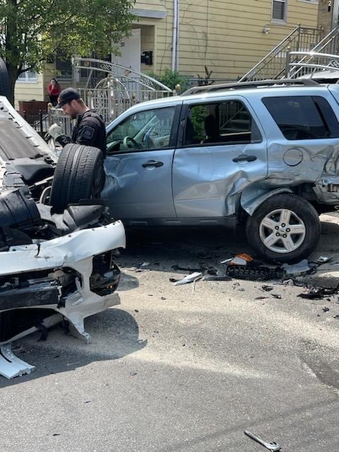 Witnesses: People armed with guns flip BMW in crash, flee the area