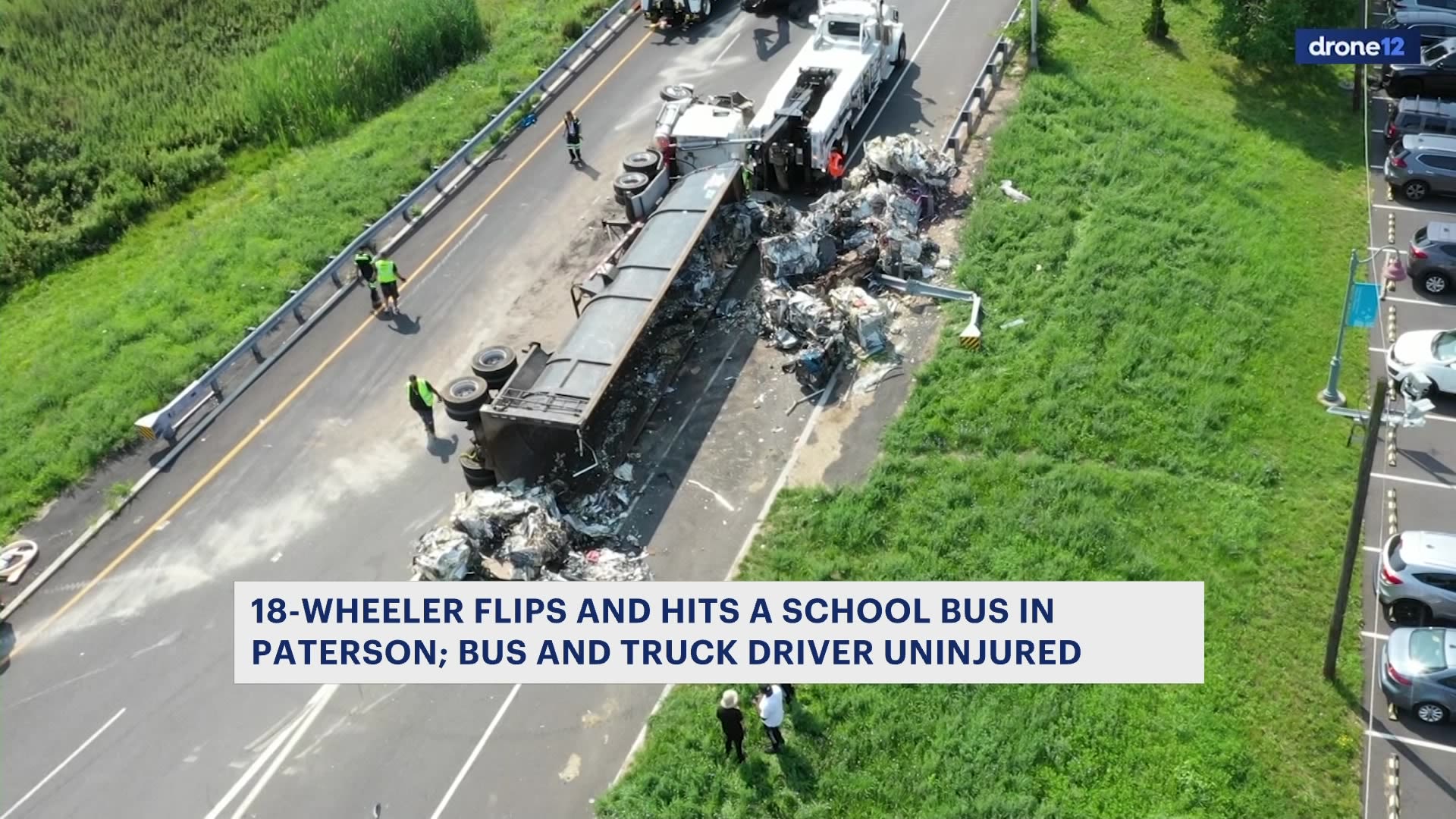 18-wheeler flips over, hits school bus in Paterson; no injuries