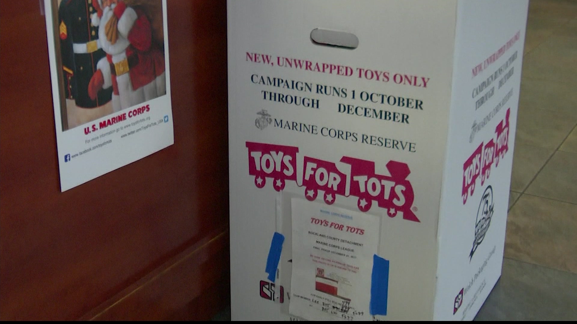 Nanuet auto shop employees fill Toys for Tots box on 1st day of donations