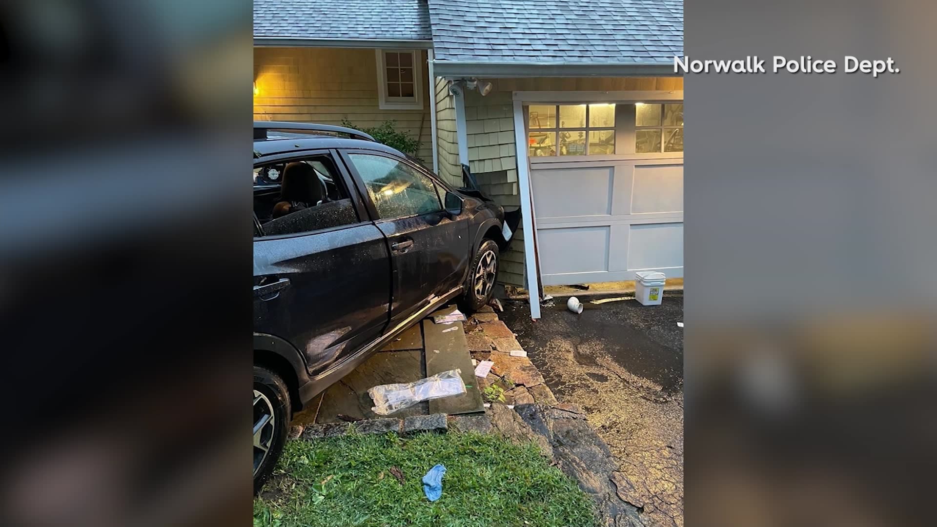 Car crashes into home in Norwalk