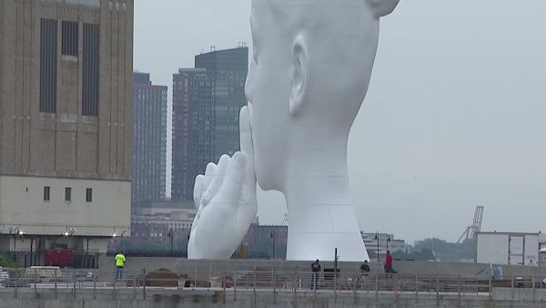 Giant sculpture of 'shushing' woman turning heads in Jersey City