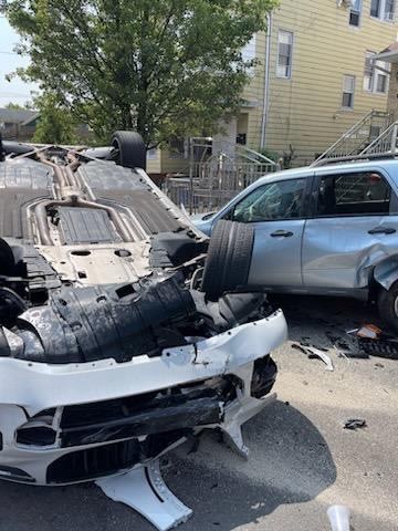 Witnesses: People armed with guns flip BMW in crash, flee the area
