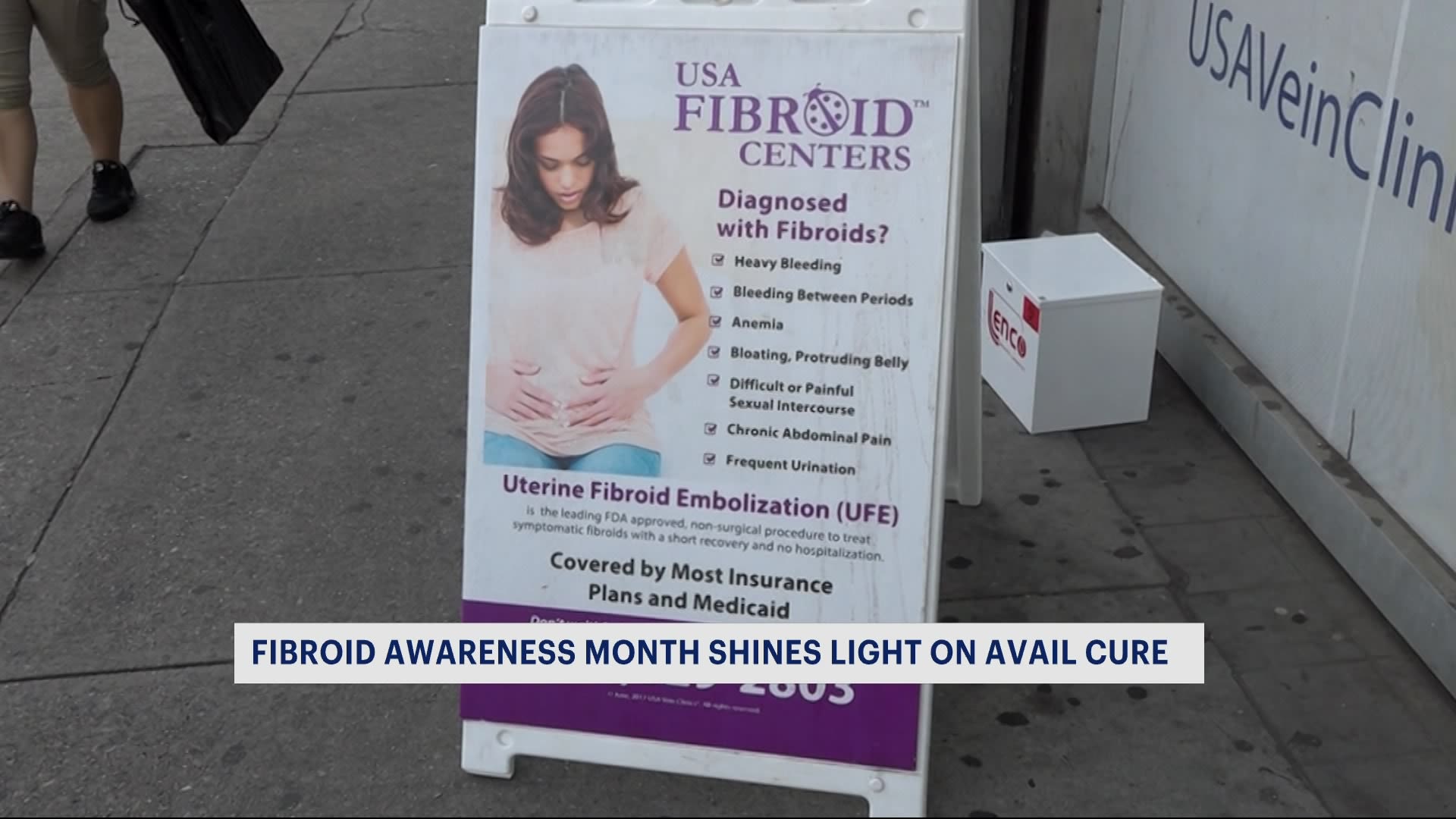 Doctor and patient shining light on fibroids for Fibroid Awareness Month