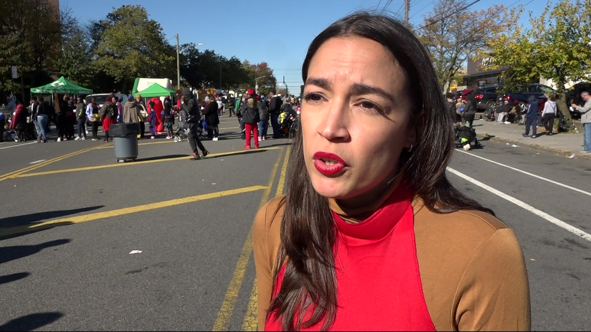 Rep. Alexandria Ocasio-Cortez speaks with voters at Castle Hill ...