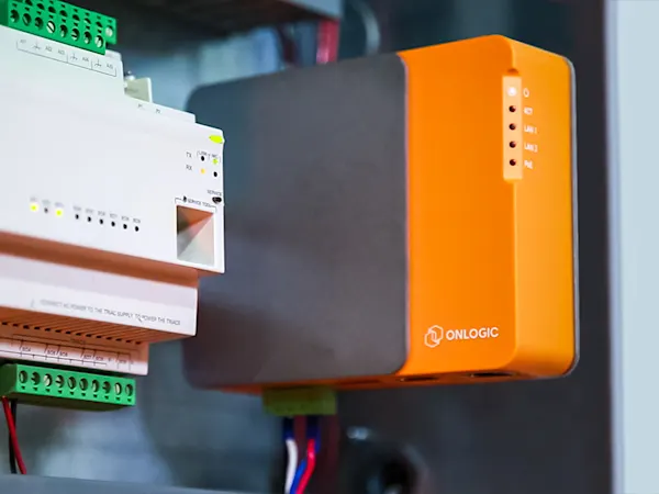 A small orange industrial computer used as an IoT gateway to capture data