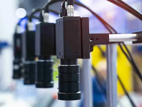 Machine learning cameras lined up in an industrial environment