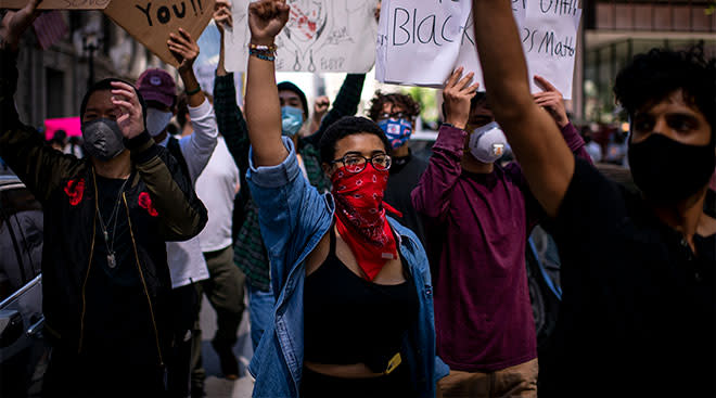 The Powerful Story Behind the Viral Image of Mom and Baby at Protests