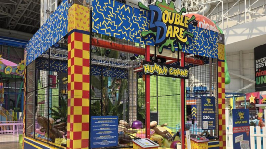 Double Dare Human Crane at American Dream - Life-Sized Claw Machine