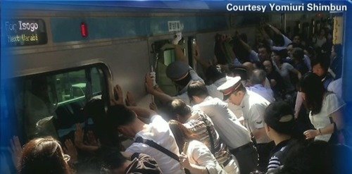 Total strangers band together to push 32-ton train off one very lucky ...