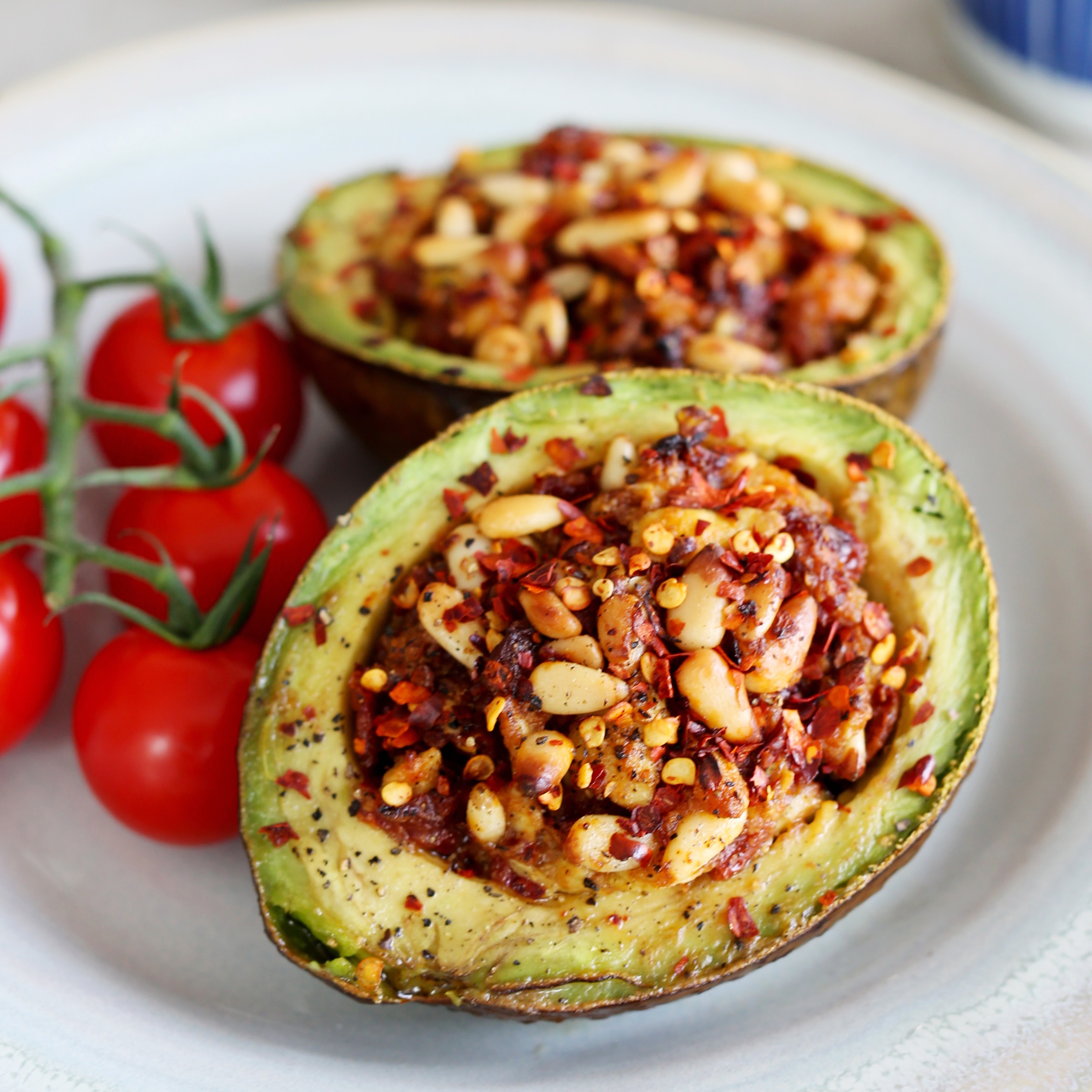 Baked Avocado With Sun-Dried Tomatoes & Pine Nuts | Deliciously Ella (UK)
