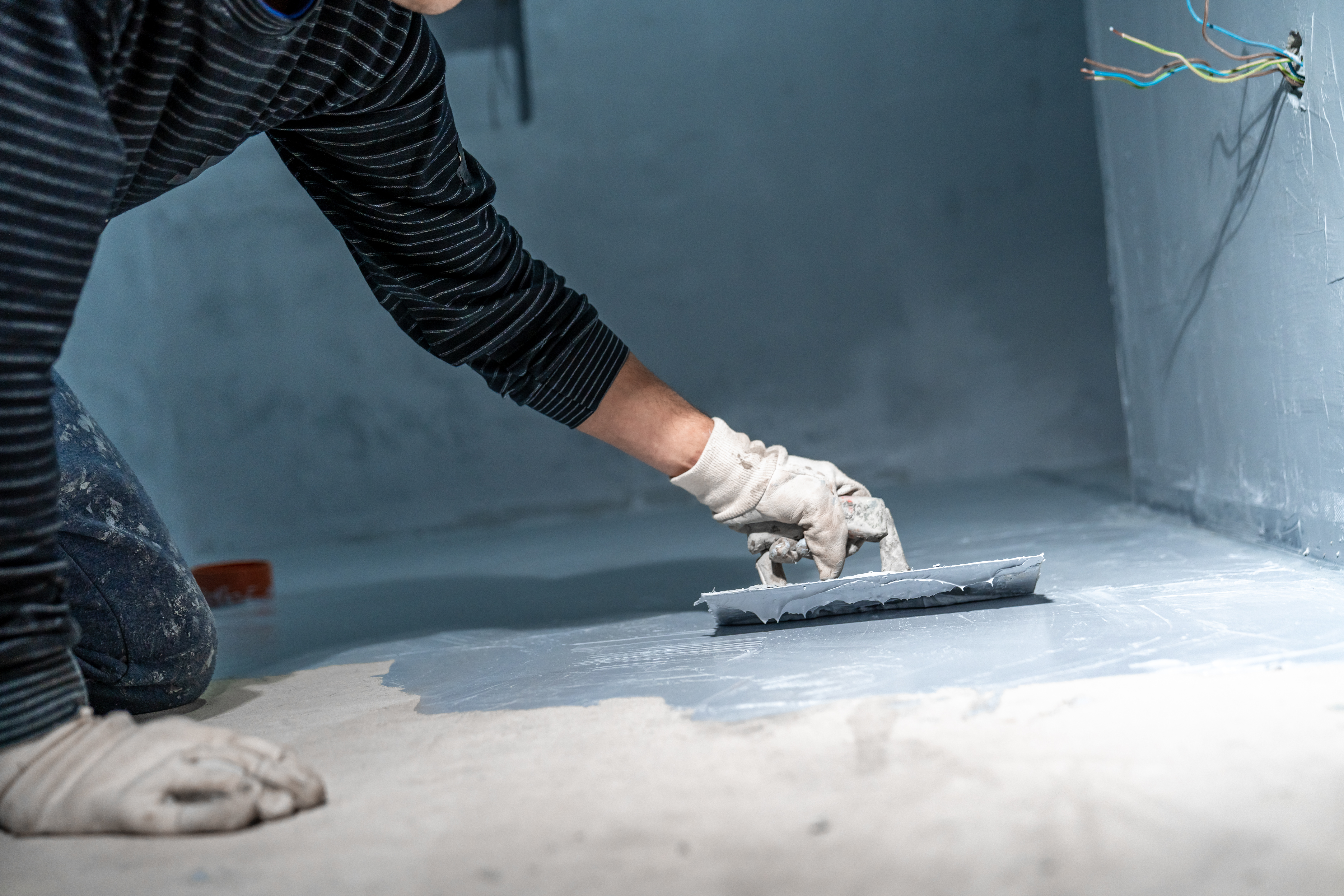 Application of cementitious waterproofing system