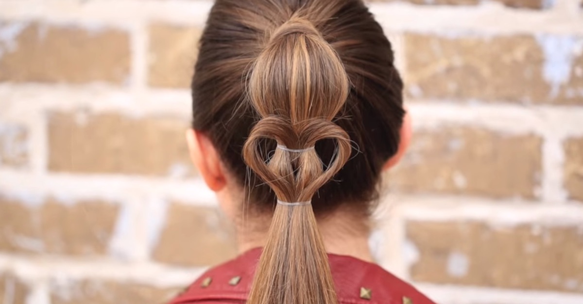 She Holds A Thin Section Of Hair From The Back Of Her Ponytail. Now Pay ...