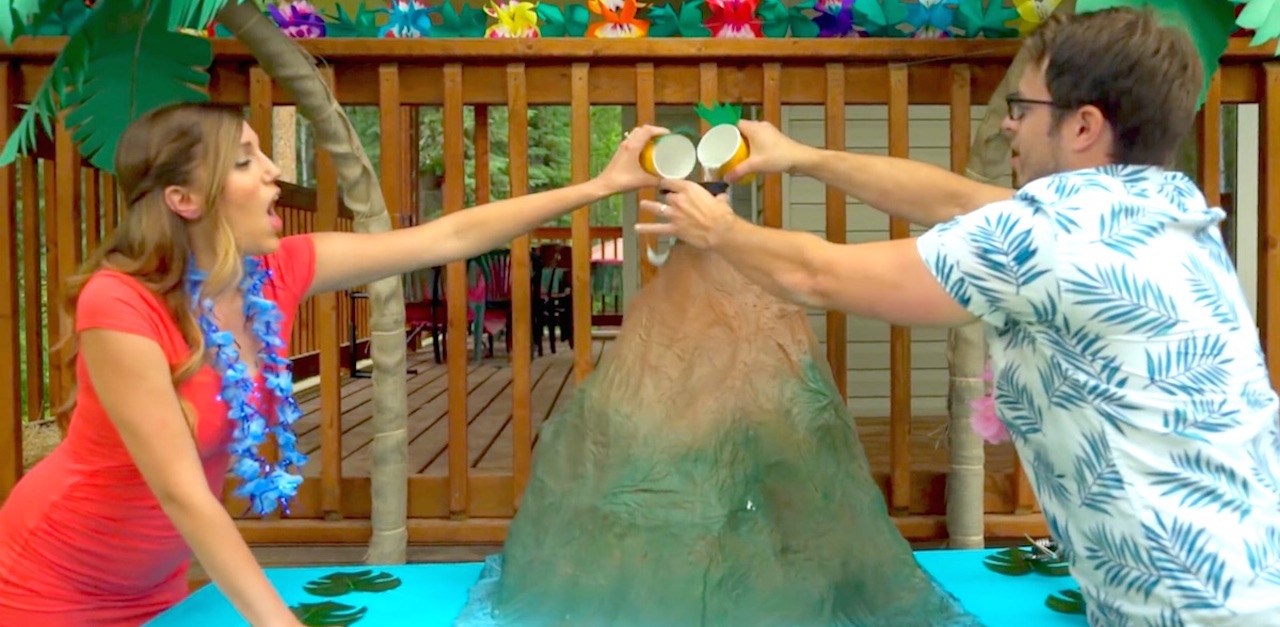 Mom And Dad To Be Pour Cups Into A Huge Volcano For An Adorable Science ...