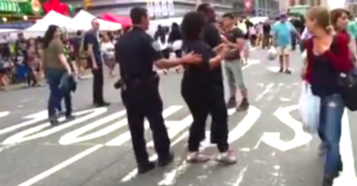 A Cop Walks Up Behind A Woman On The Street... Now Watch What He Does ...