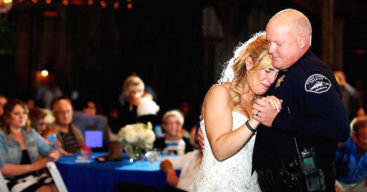 Bride Cries Against Cop's Chest. Then They Look Closely At The Back Of ...