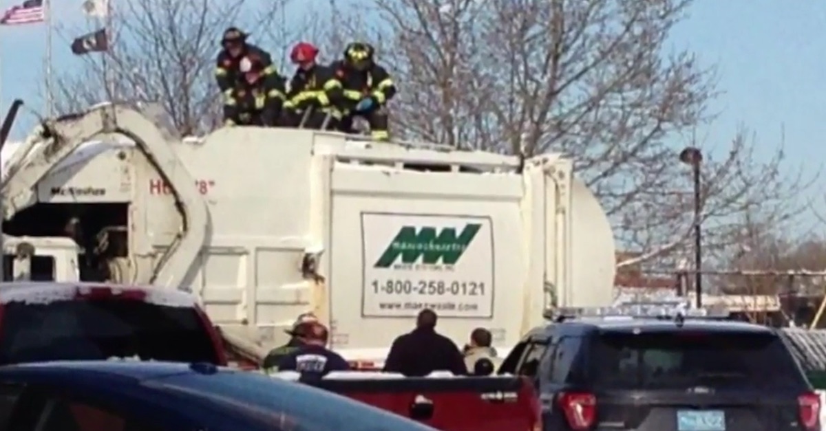 Firefighters Stand On Top Of A Garbage Truck. What They Pull Out From ...