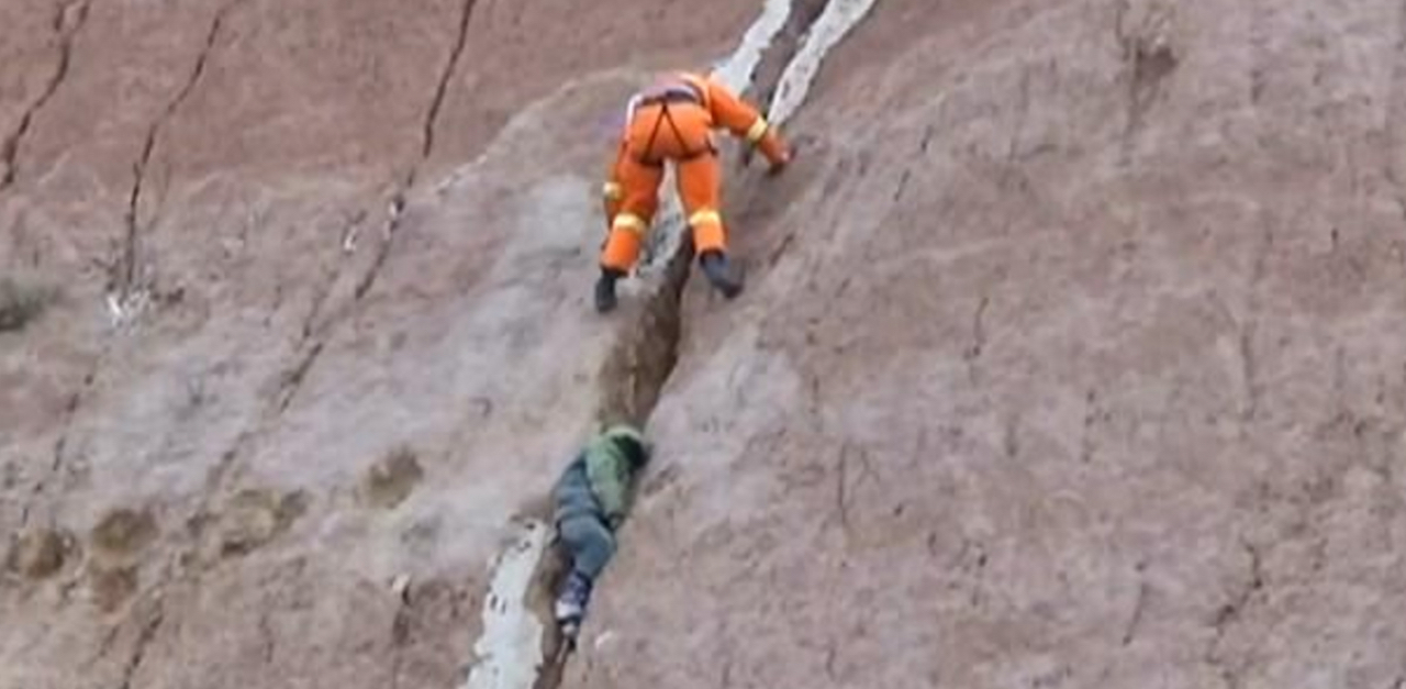 Firefighter Saves Boy Stuck In The Side Of A Cliff | LittleThings.com