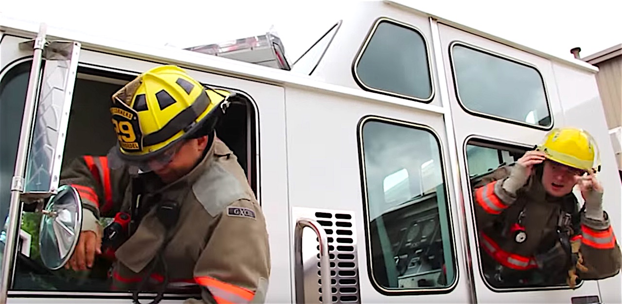 Firefighter Adjusts A Camera In The Truck. Then, He Steps Back And It ...