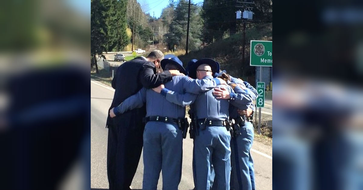 Officers Huddle Together In The Middle Of A Highway. Now Look At The ...