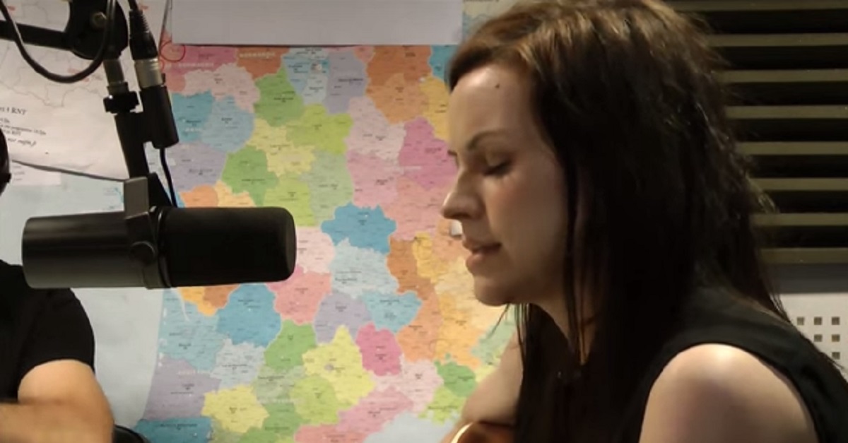 She Sits Down In Front Of A Microphone With Her Guitar. When She Starts ...