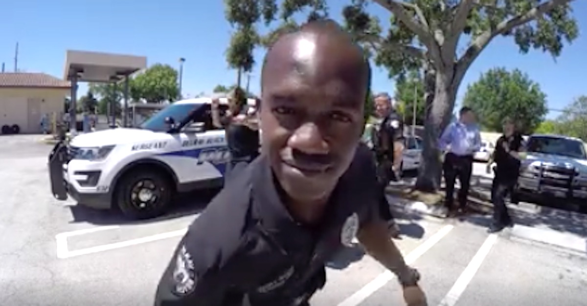 Cop Takes A Closer Look At A Camera In The Parking Lot. The Moment He ...