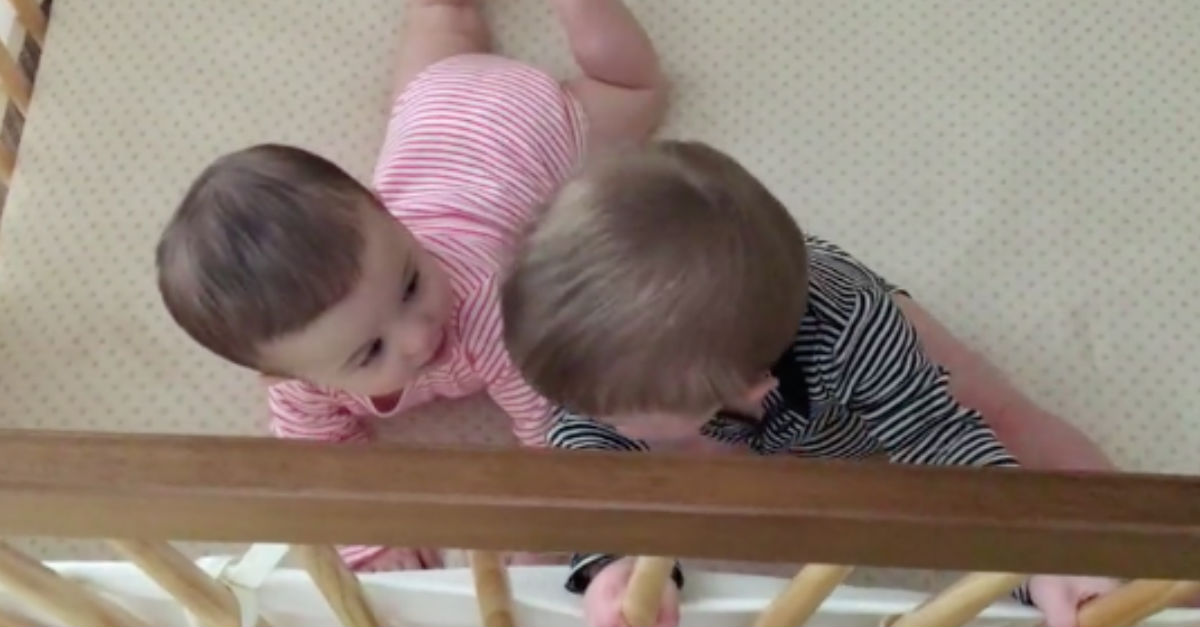 Twins Giggle Together In Their Crib | LittleThings.com
