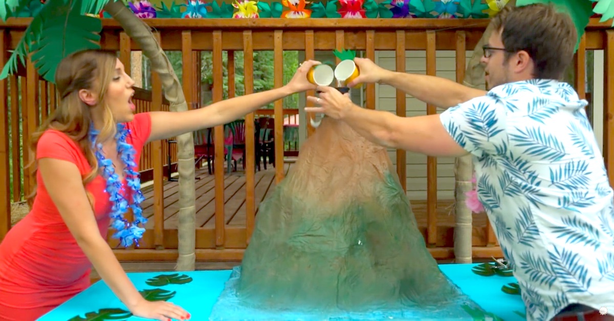 Mom And Dad To Be Pour Cups Into A Huge Volcano For An Adorable Science ...