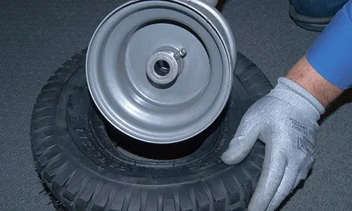 How to replace a riding lawn mower front tire | Repair guide