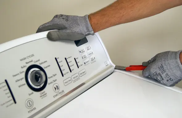 How to replace the electronic control board on a top-load washer ...