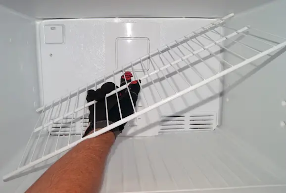 How to replace the defrost heater in a top-freezer refrigerator | Repair guide