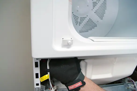 How to replace a laundry center dryer door switch | Repair guide