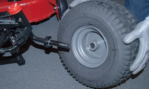 How to replace a riding lawn mower front tire | Repair guide