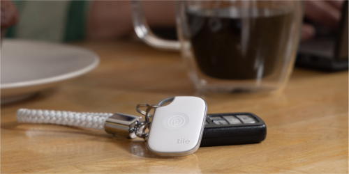 A white Tile Pro and key on a keychain