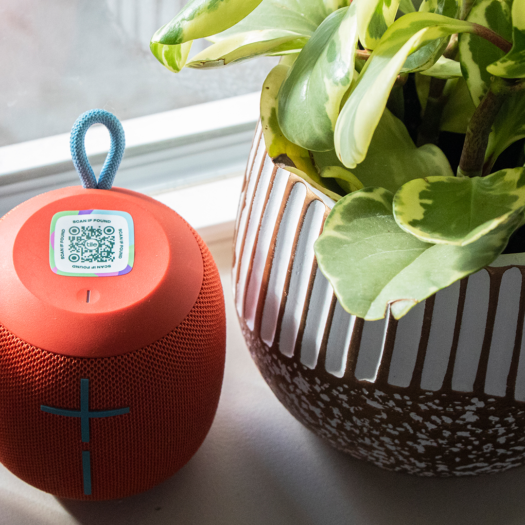 A Lost and Found Label attached to a bluetooth speaker.