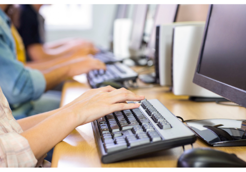 Person using computer in a classroom