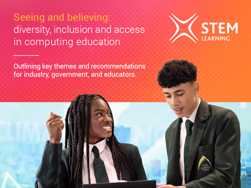 Two students, one holding a laptop, engage happily in a classroom ...