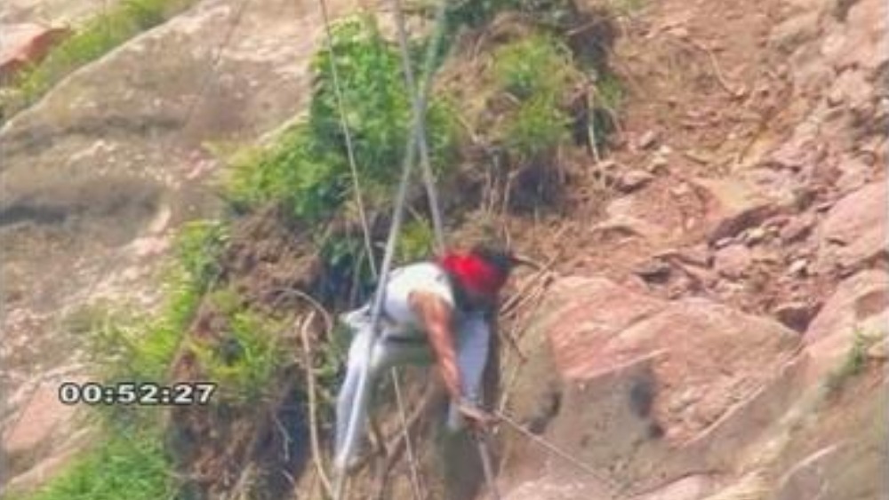 Blindfolded Chinese tightrope walker survives high-wire fall as he ...