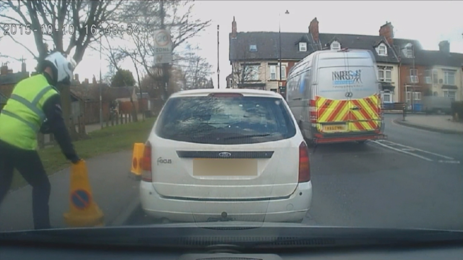 Traffic warden caught on camera moving 'No Parking' cone to give driver ...