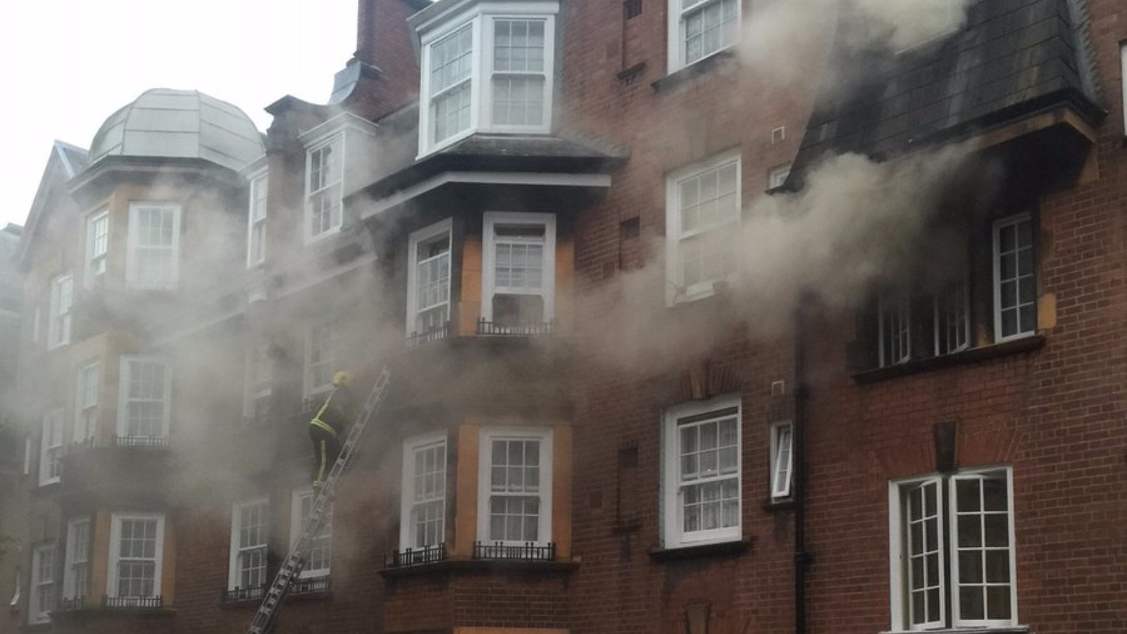 Children's rescue from burning building caught on camera | ITV News London
