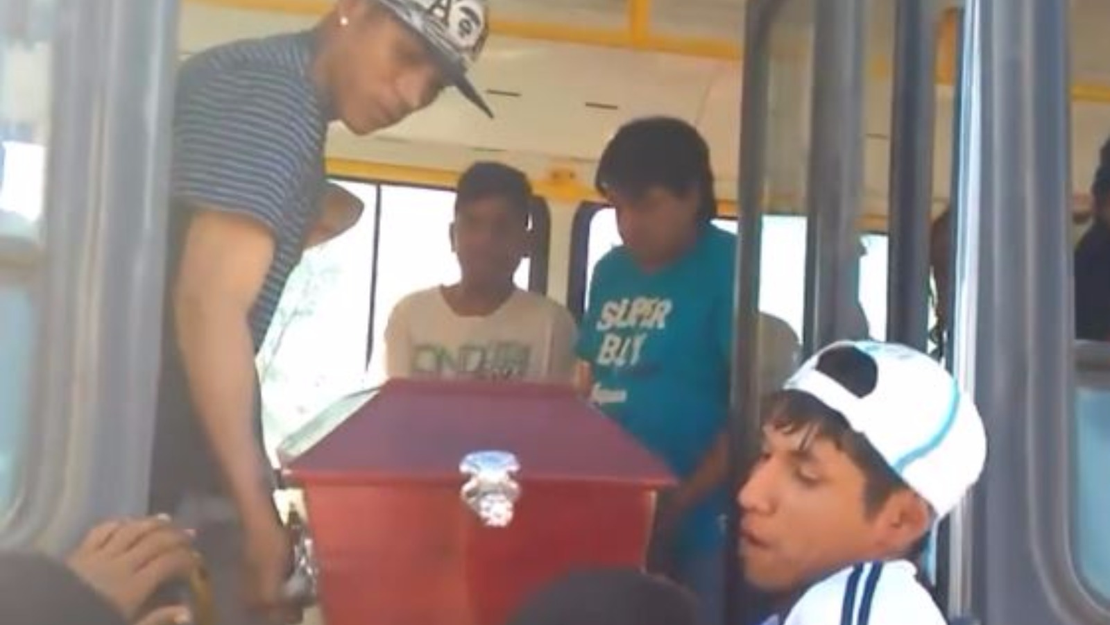 Family carry coffin onto crowded bus after hearse breaks down | ITV News