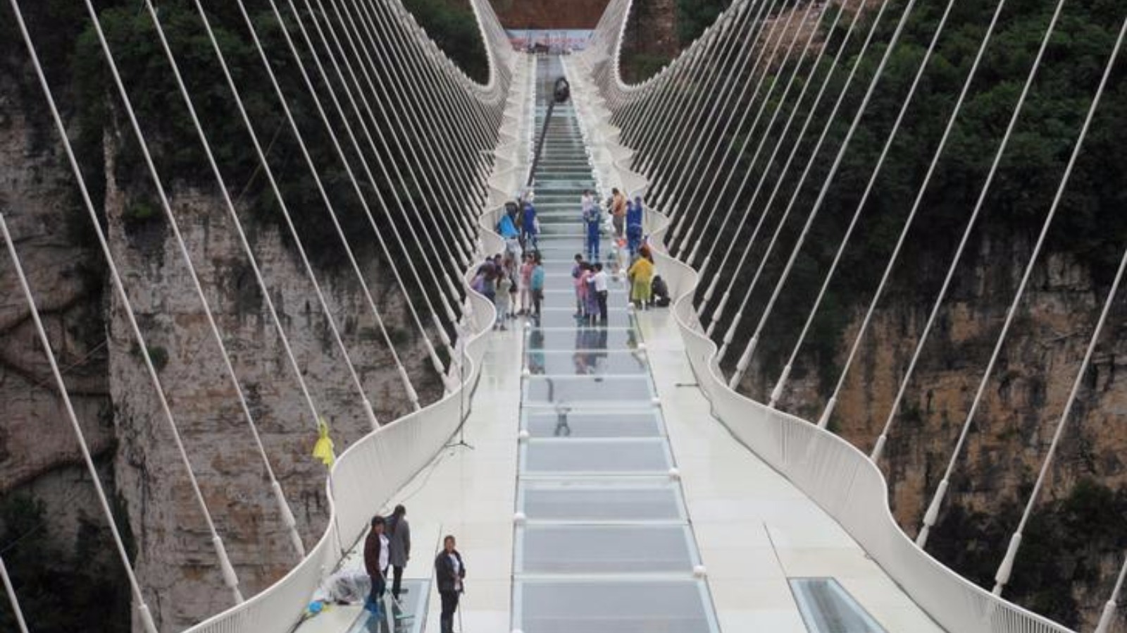 World's 'highest' glass bridge opens in China | ITV News
