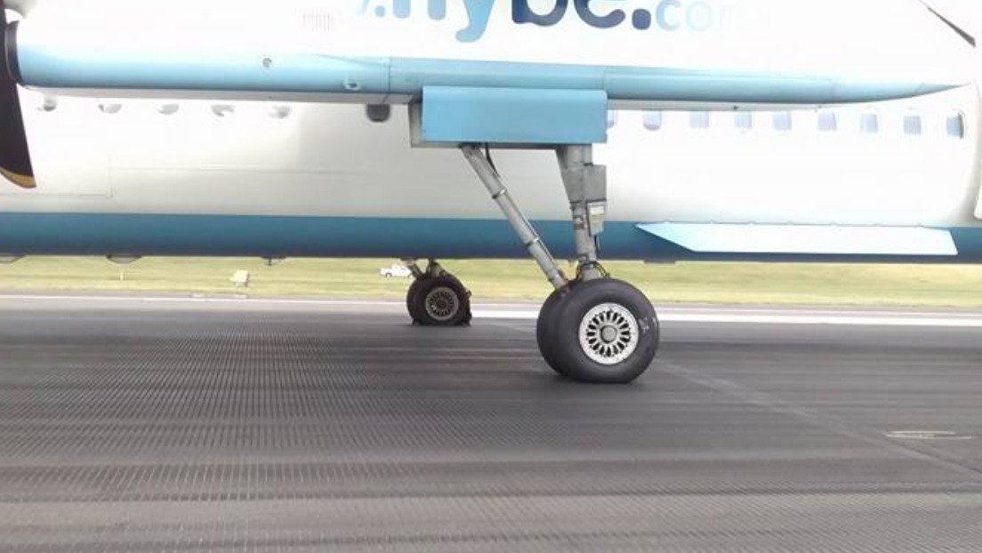 Plane makes emergency landing after tyre bursts | ITV News