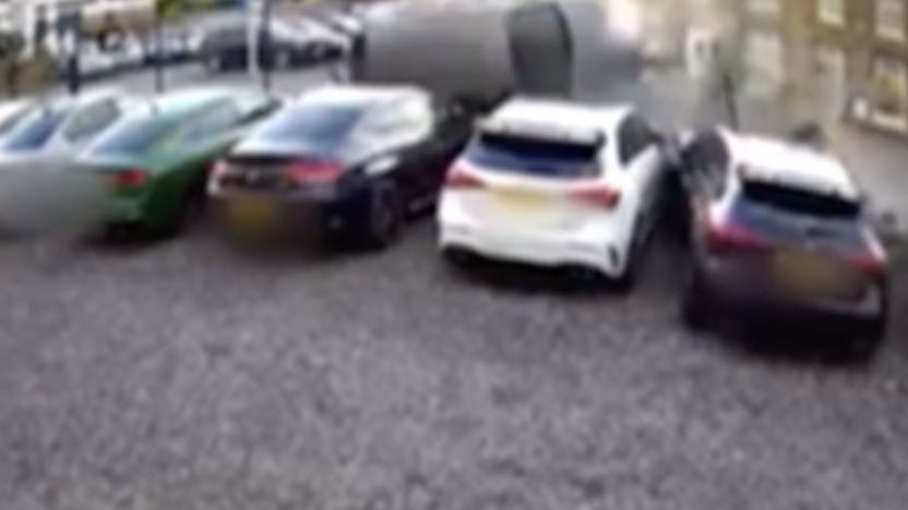 Moment car crashes into prestige car dealership after police chase ...