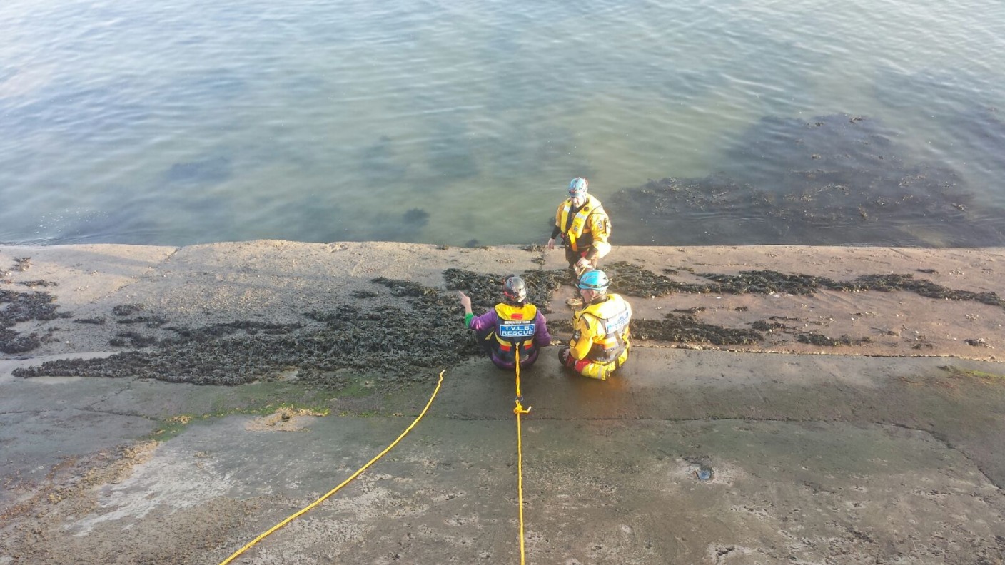Stranded woman rescued from sea wall after getting stuck while out on ...